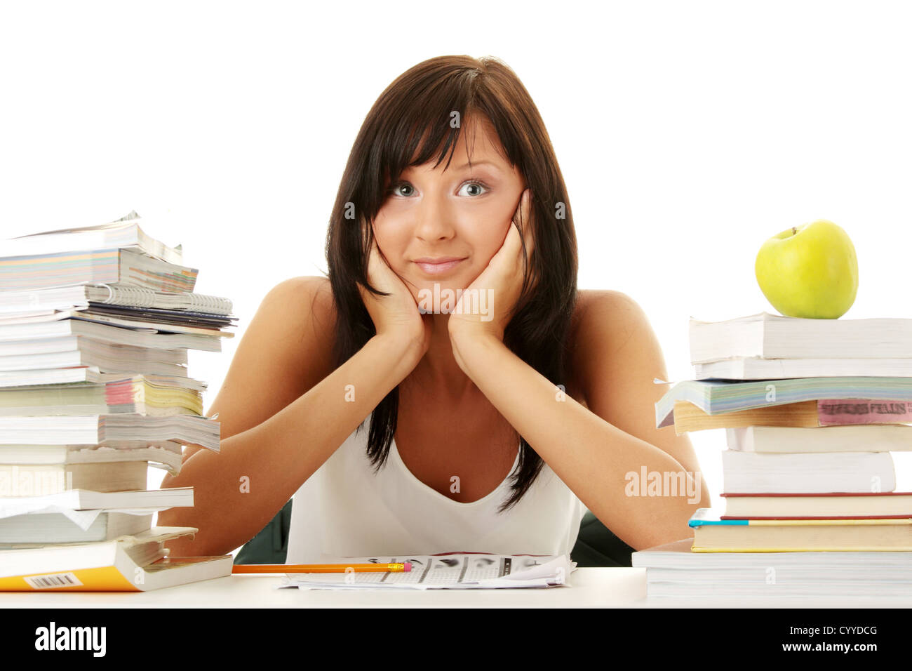 Young woman studying at the desk isolated on white background Stock ...