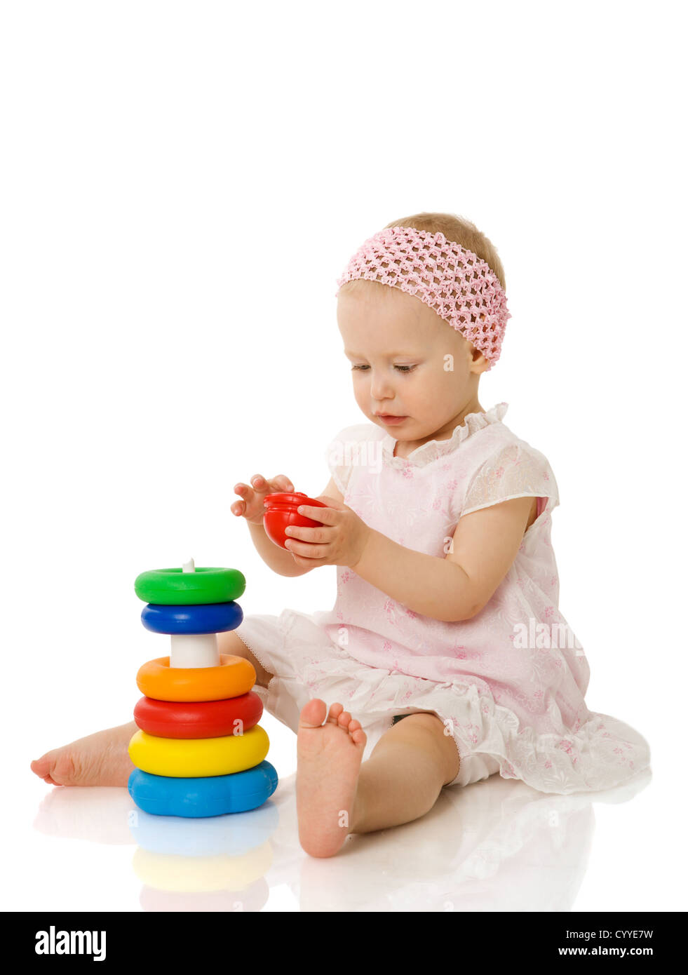 Baby playing with pyramid isolated on white Stock Photo - Alamy