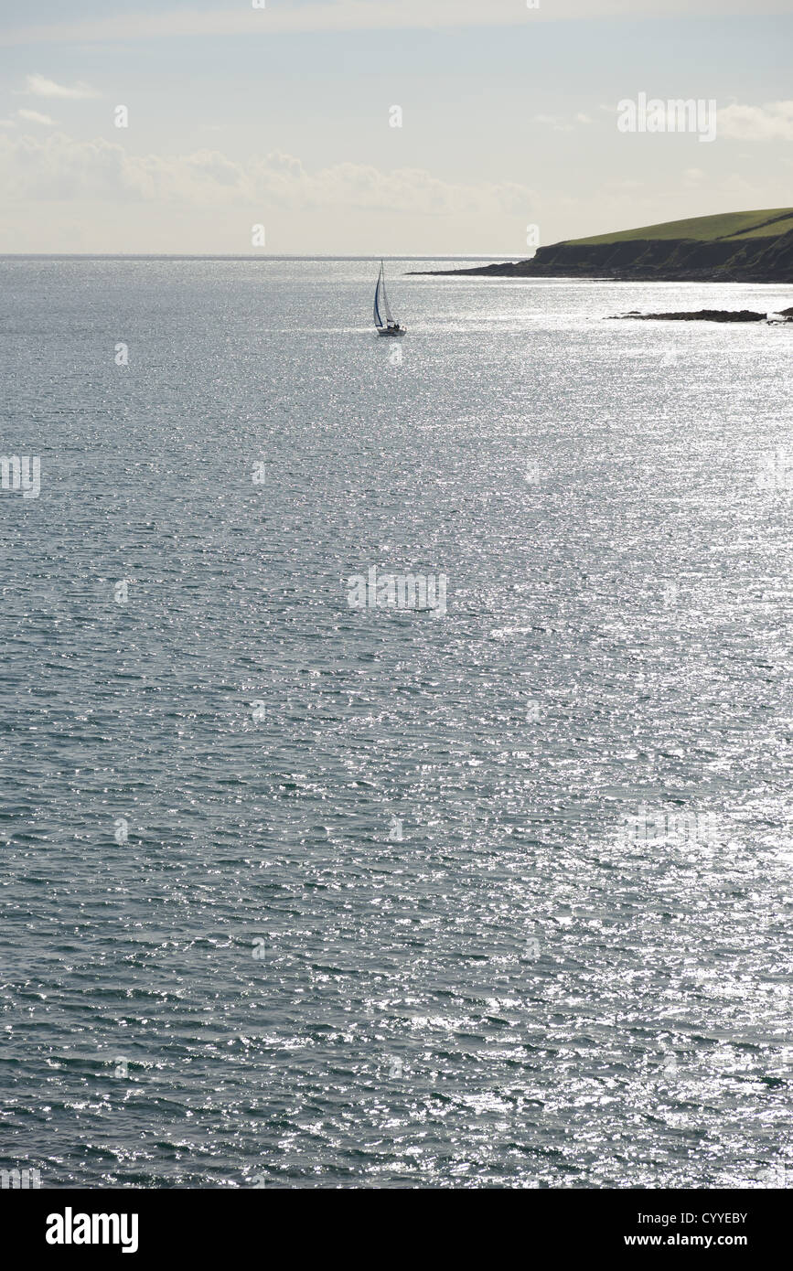 Yacht sailing along a dangerous coast Stock Photo - Alamy
