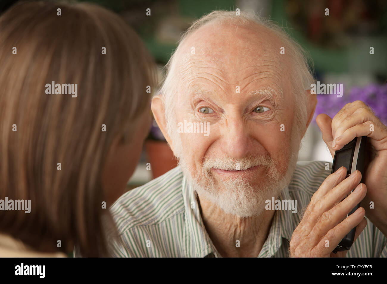 Grumpy senior couple at home with a telephone Stock Photo - Alamy