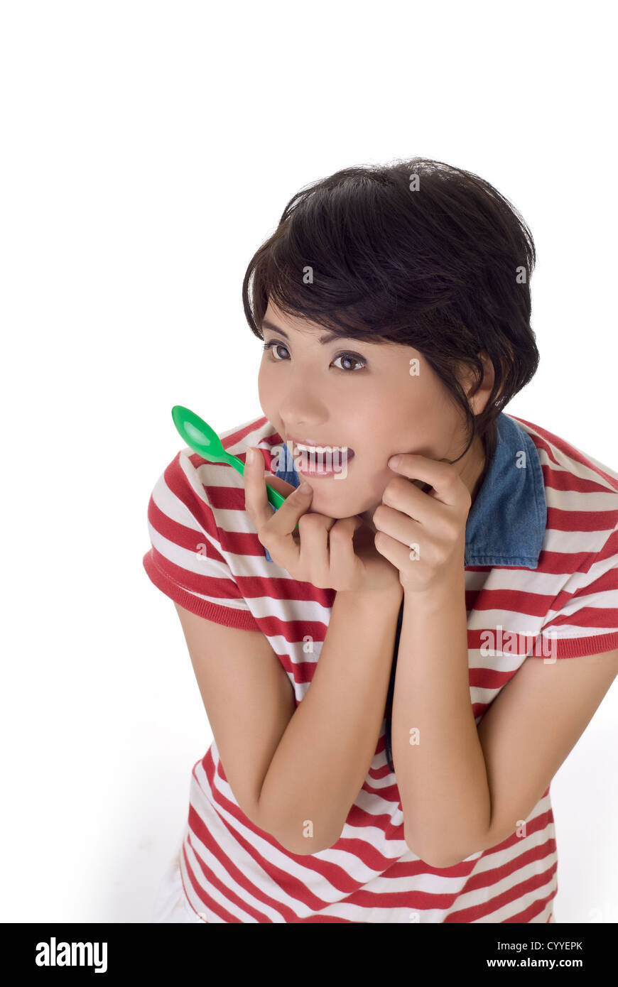 Girl with tablespoon with exciting expression, closeup portrait on ...