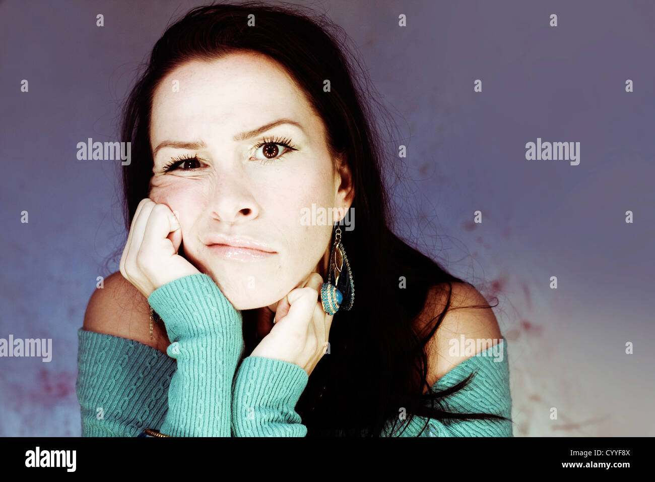 Attractive young woman head in hands bored Stock Photo - Alamy