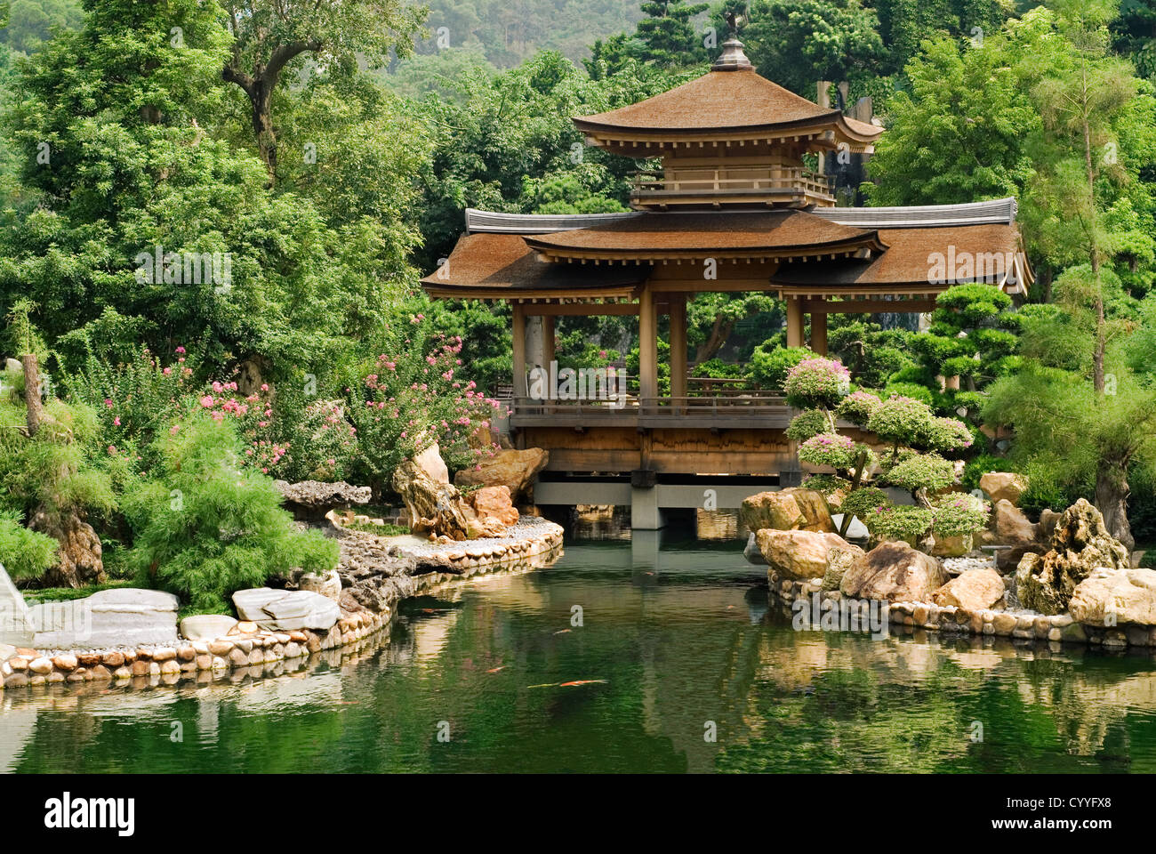 It is traditional Chinese house near the pond Stock Photo - Alamy
