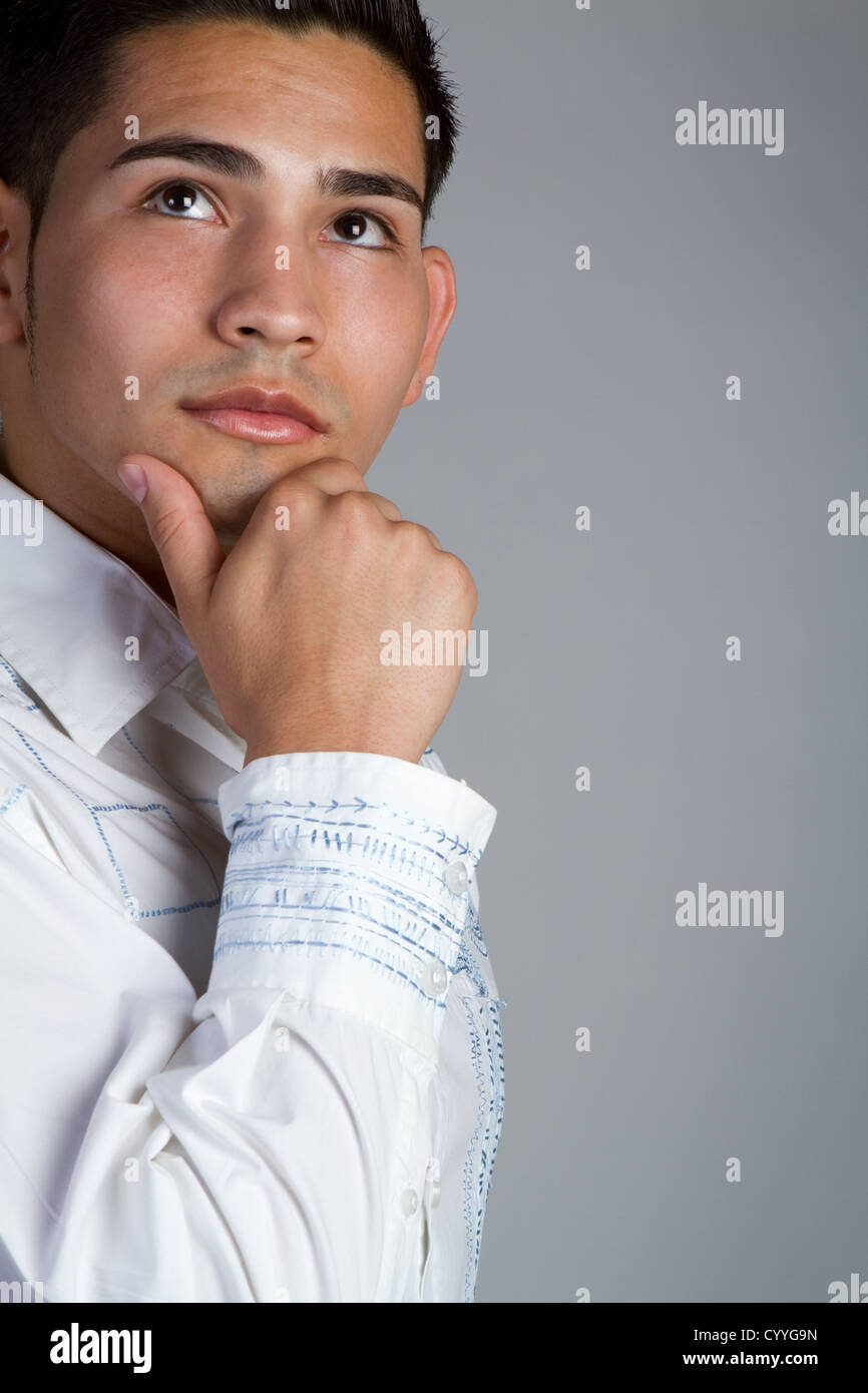 Latino male contemplating hi-res stock photography and images - Alamy