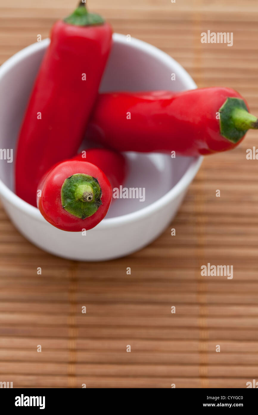 Two large red cayenne chili peppers Stock Photo - Alamy