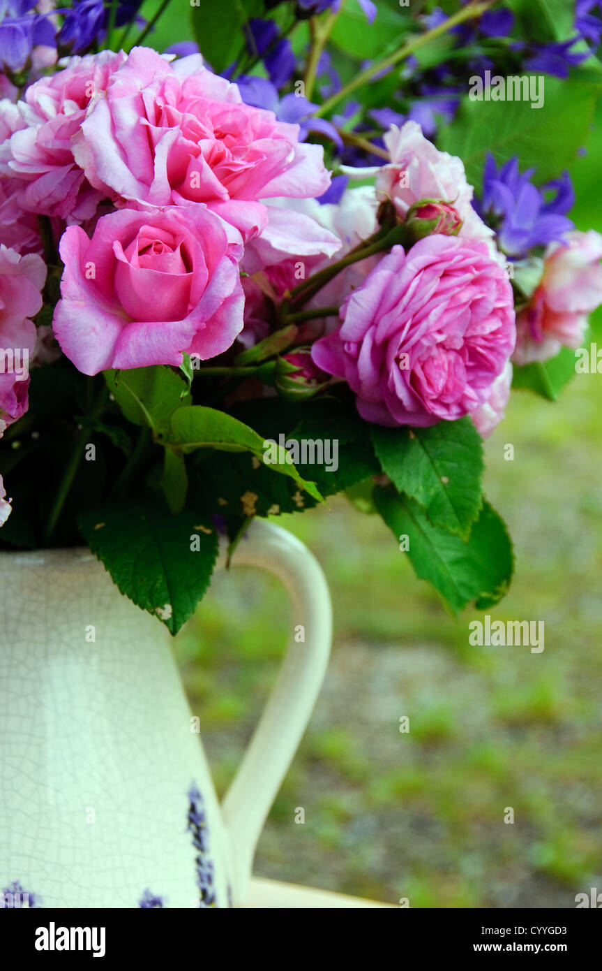 Bouquet of pink roses and bluebells Stock Photo - Alamy