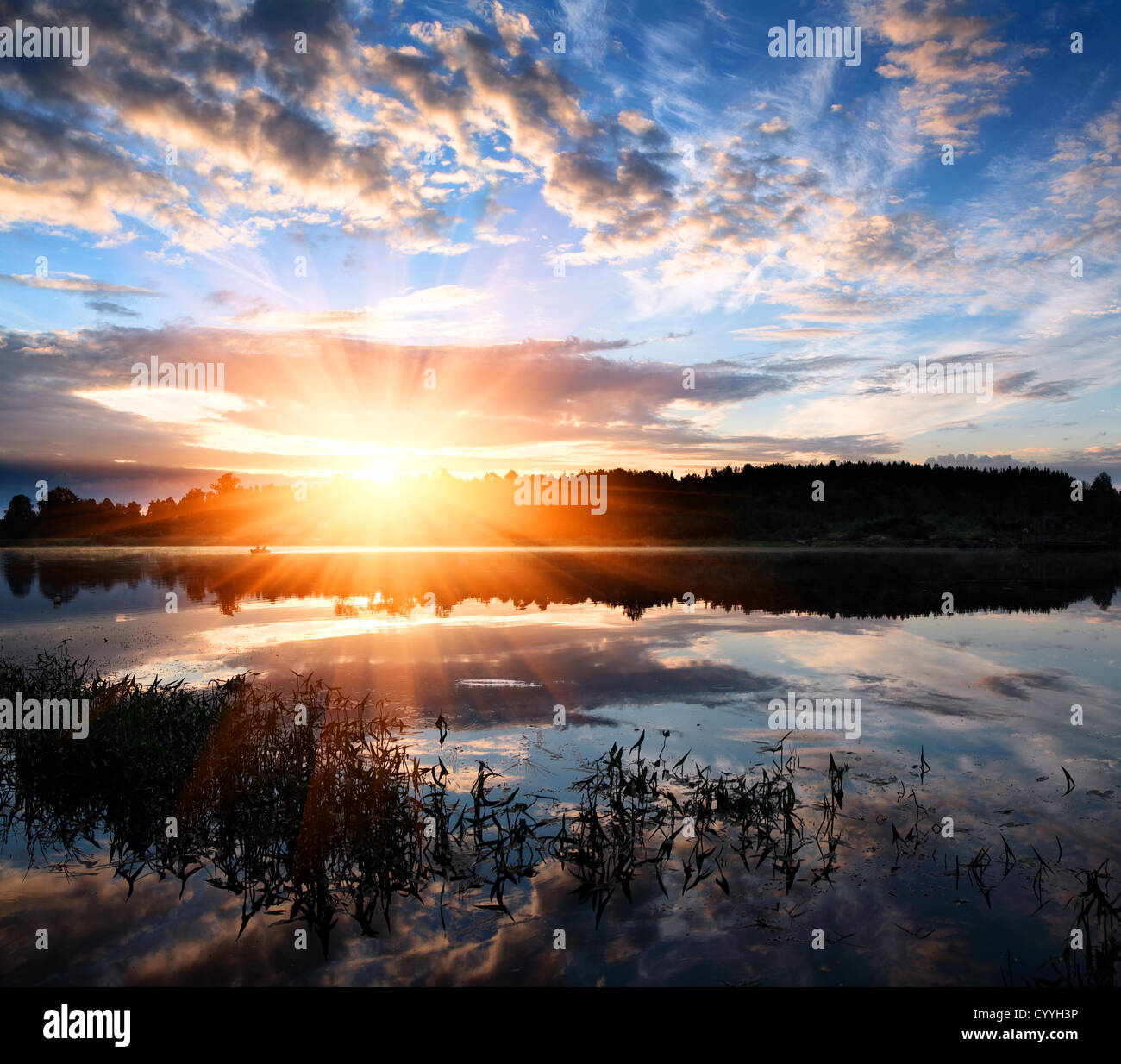 Dawn over the surface of a lake Stock Photo - Alamy