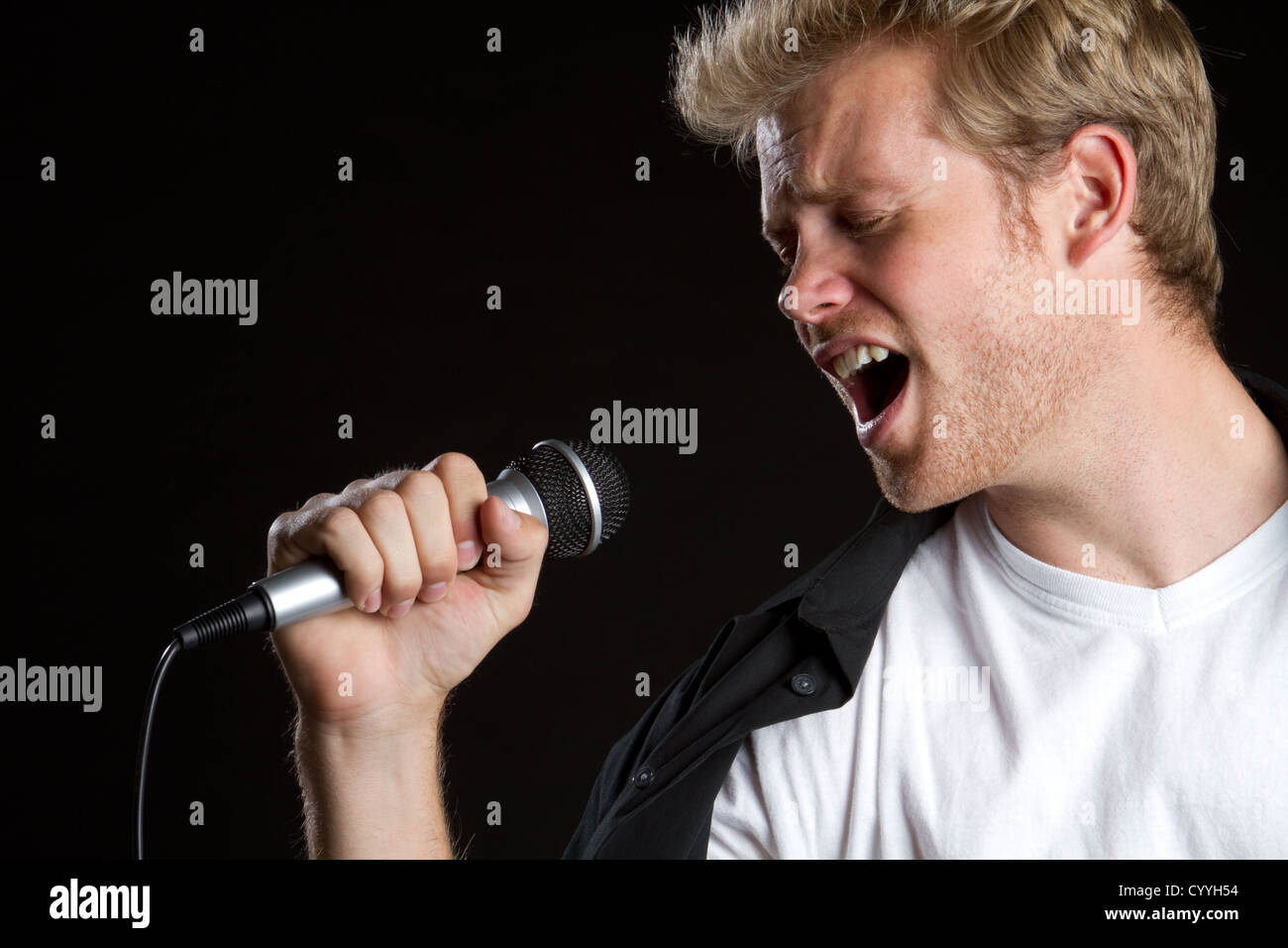 Karaoke Singer Man Stock Photo - Alamy