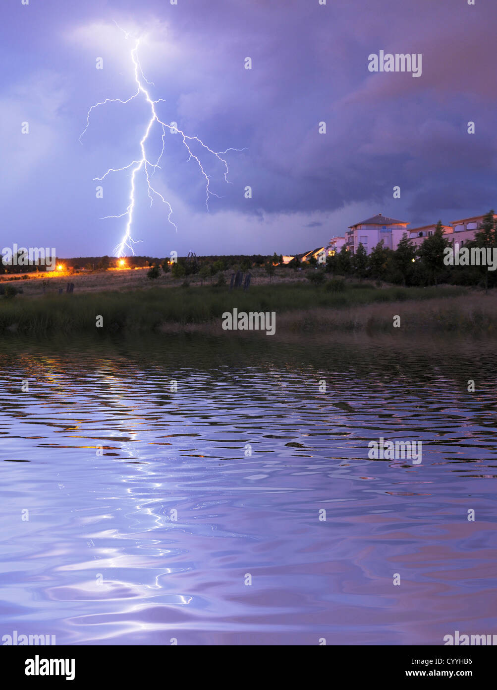 lightning on a thunderstorm in a park with cloudy sky Stock Photo - Alamy