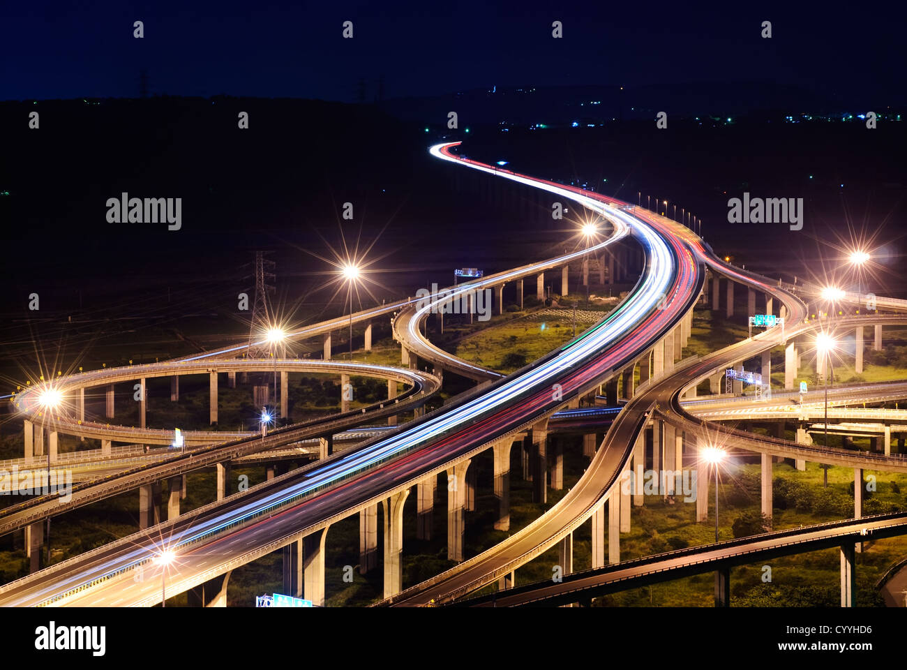 Freeway in night with cars light in modern city Stock Photo - Alamy