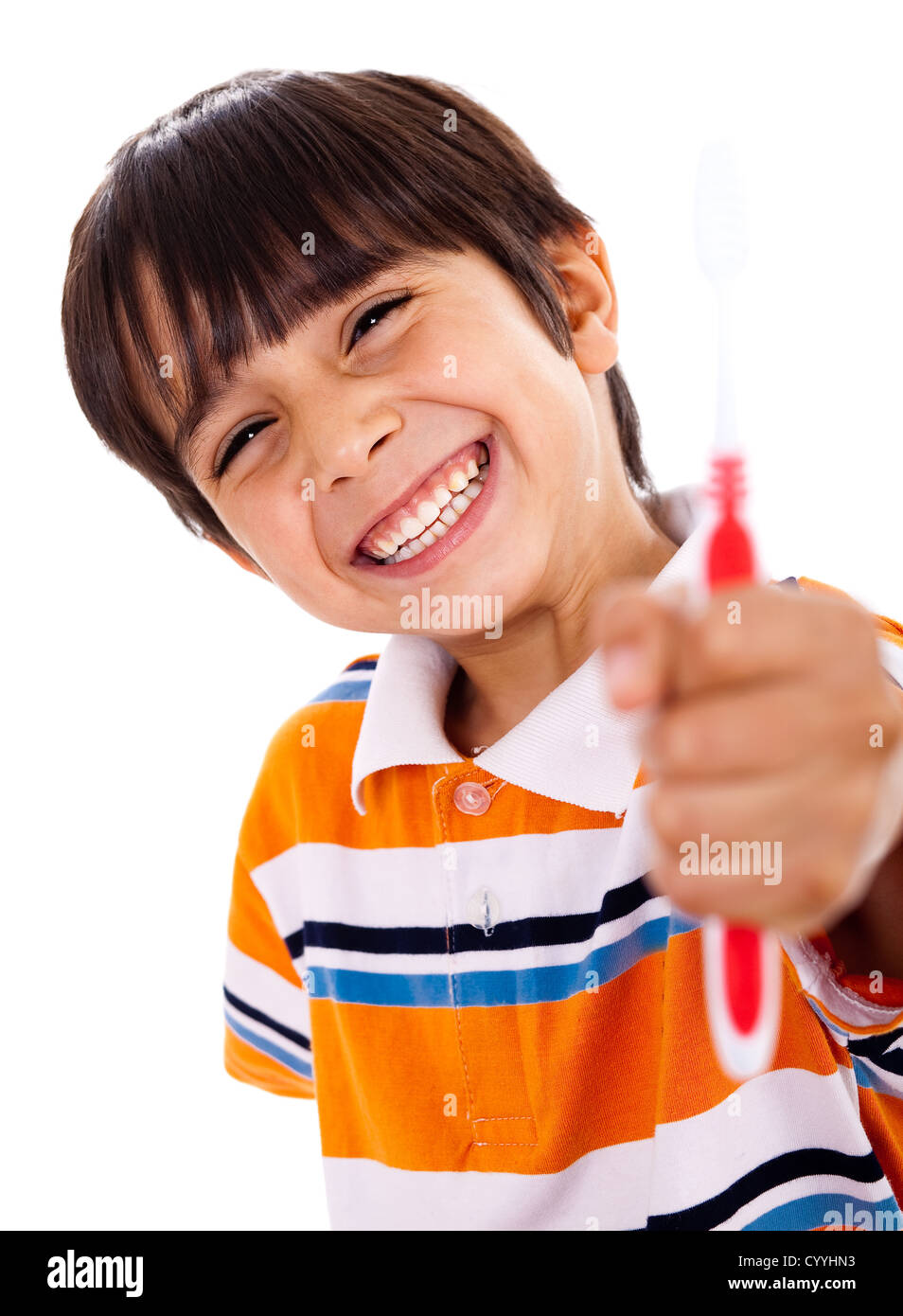 Happy young boy showing the toothbrush on isoalted background Stock ...