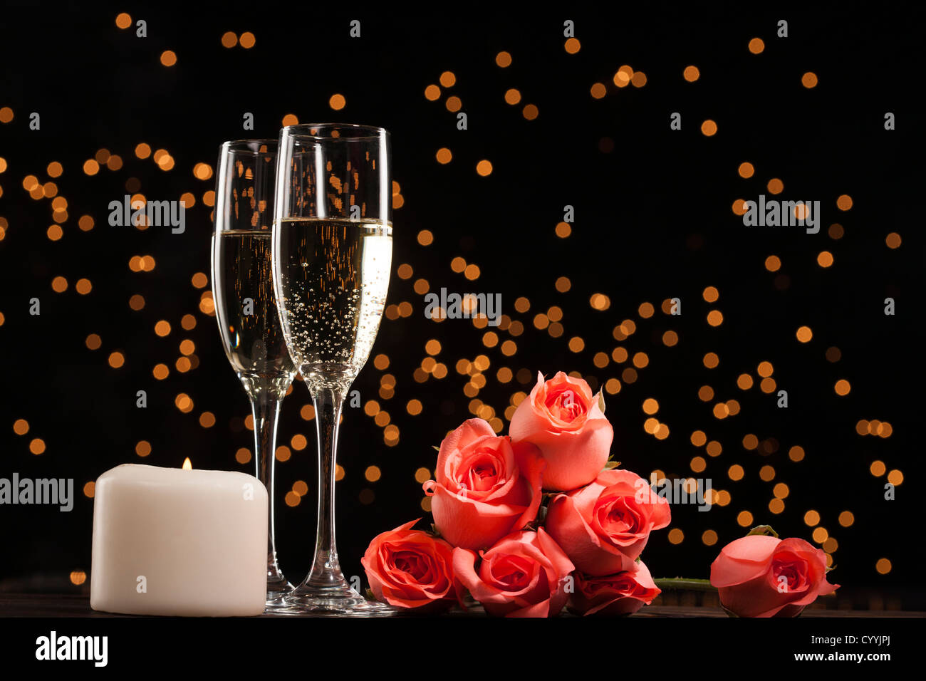 Champagne and red roses Stock Photo - Alamy