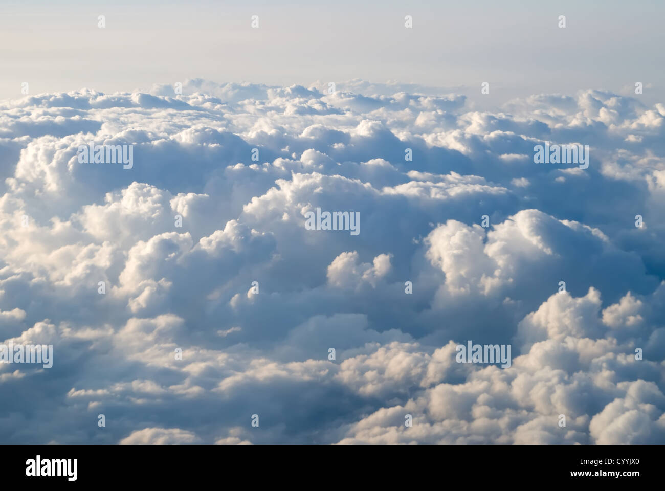 View above the earth at the clouds below Stock Photo - Alamy