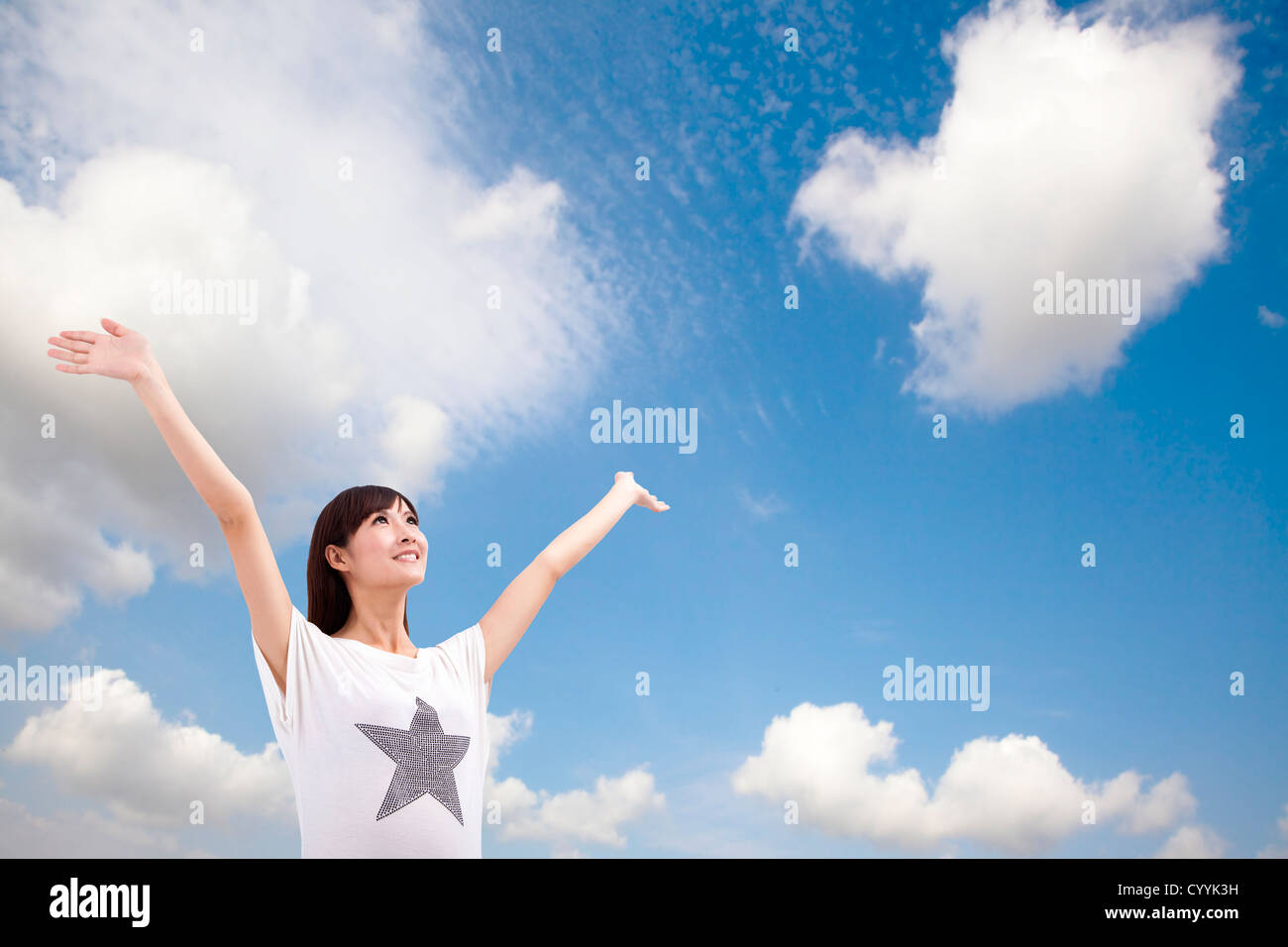 Happy young woman watching cloud and sky Stock Photo - Alamy