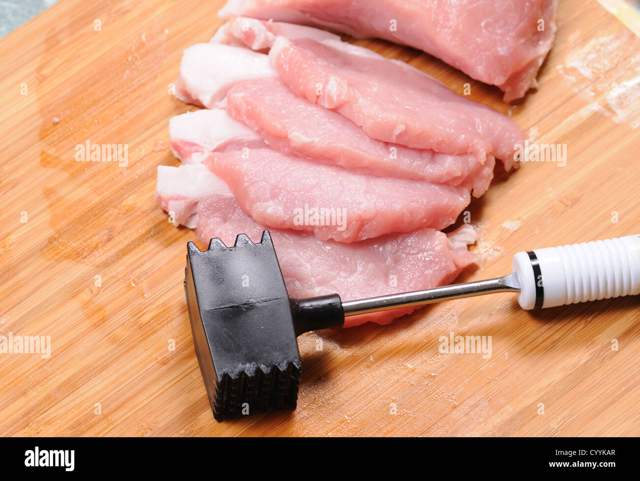 The cook prepares a chop from pork Stock Photo - Alamy