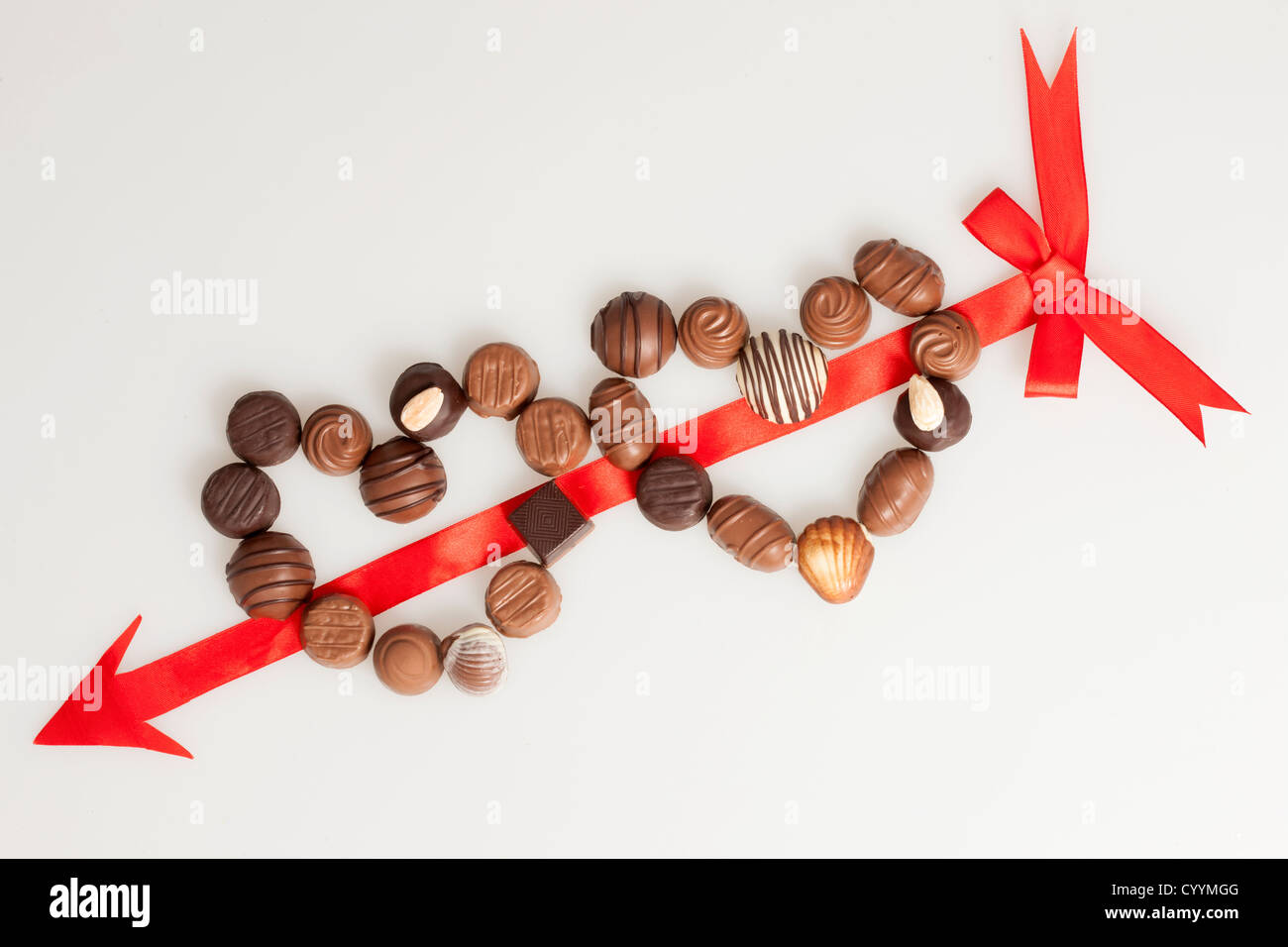Chocolate and arrow sign Stock Photo - Alamy