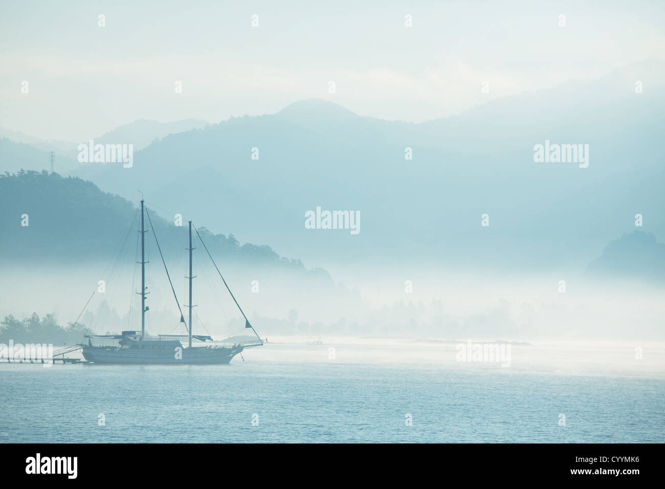 yacht in morning bay Stock Photo - Alamy
