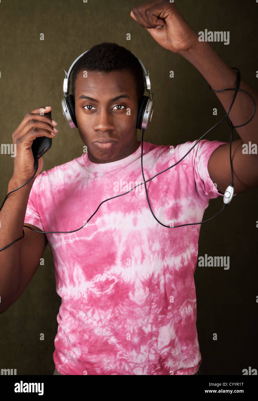 Young Black male dancing to music from headphones Stock Photo - Alamy
