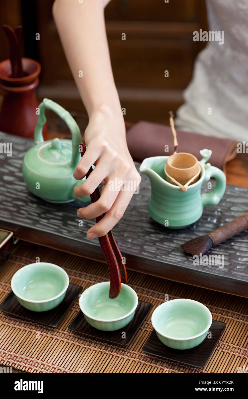 Young woman performing tea ceremony Stock Photo - Alamy