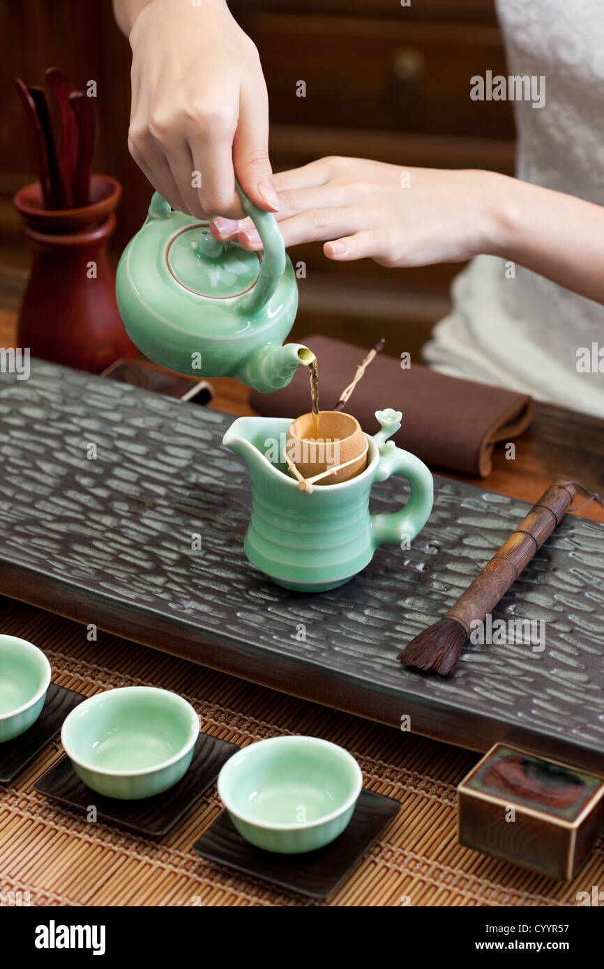 Young woman performing tea ceremony Stock Photo - Alamy