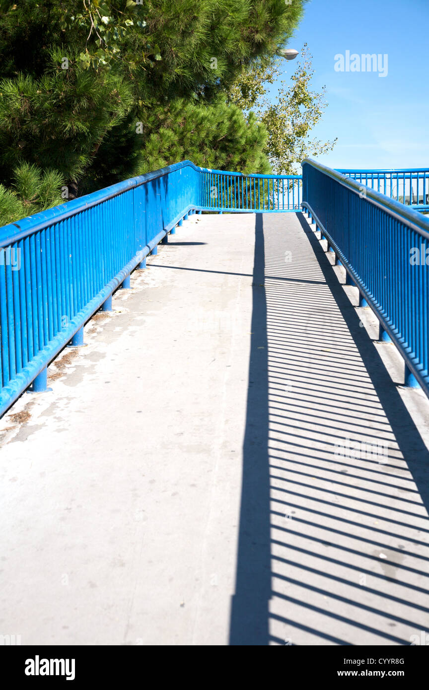 footbridge with blue railing in madrid city Stock Photo - Alamy