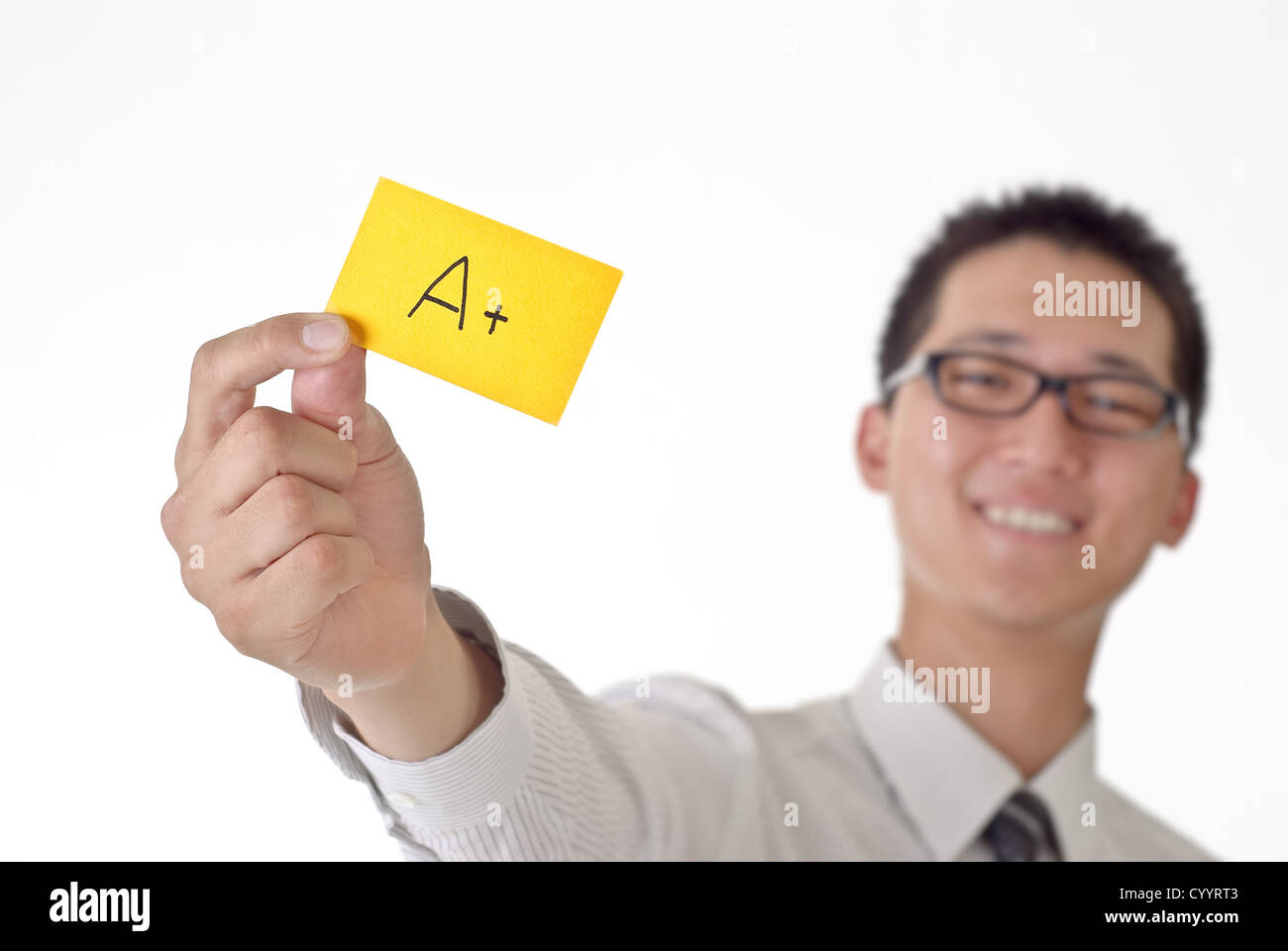 A plus graph on yellow card holding by Asian business man Stock Photo ...