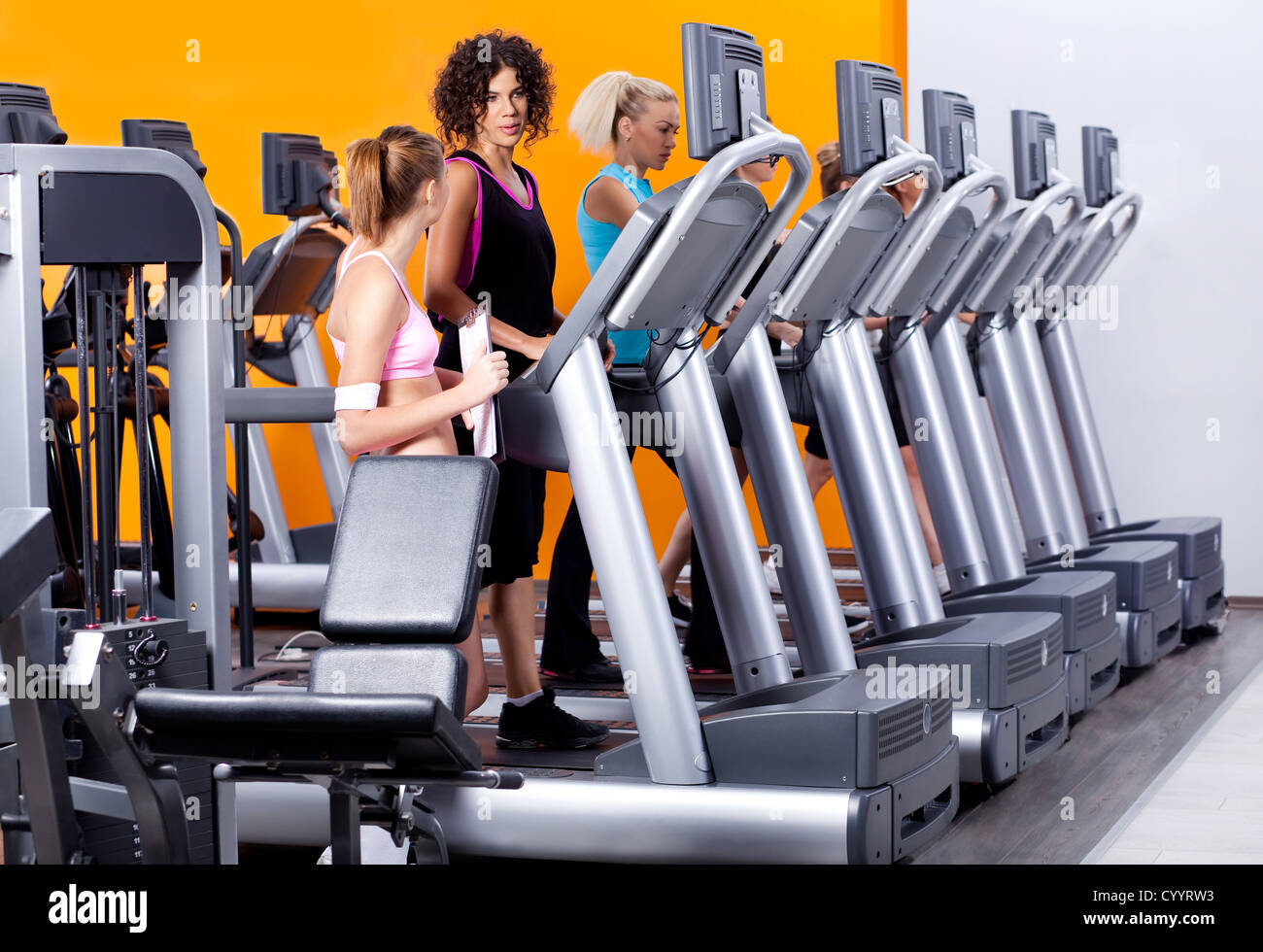 lady instructor providimh training to ladies in gym Stock Photo - Alamy