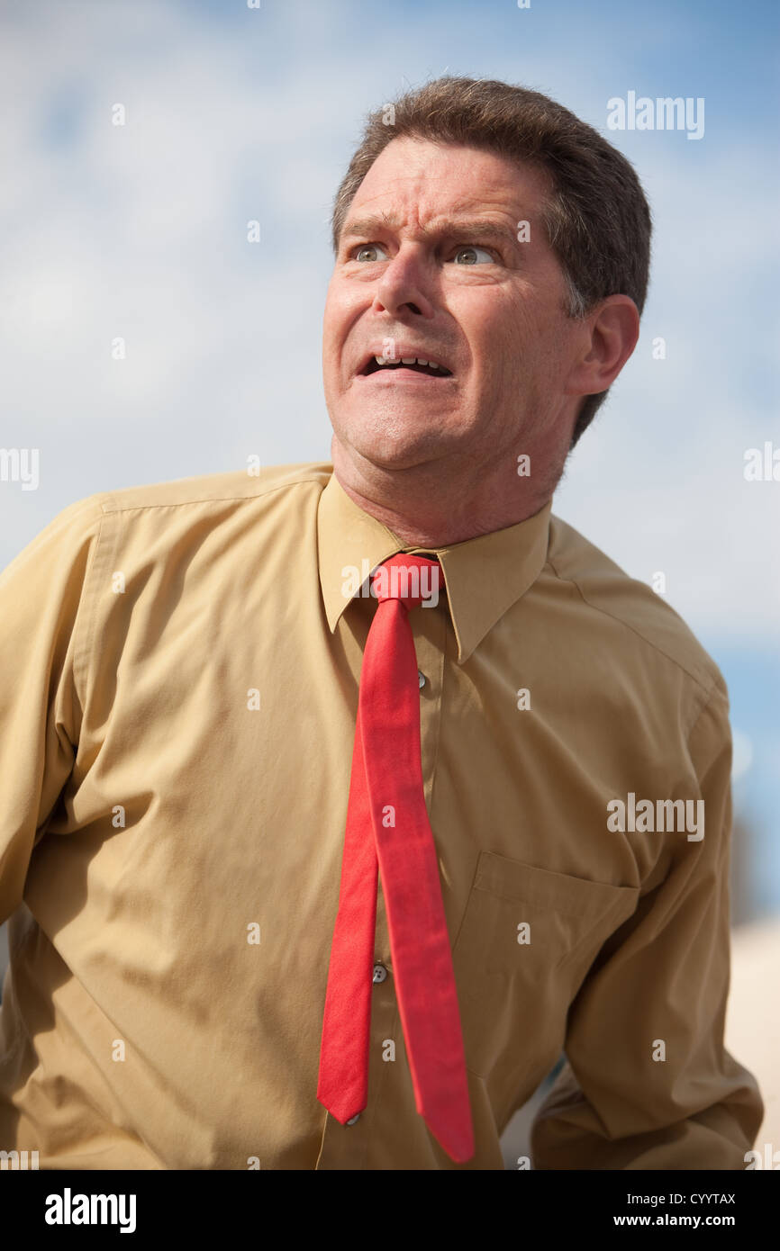 Caucasian businessman looks scared Stock Photo - Alamy