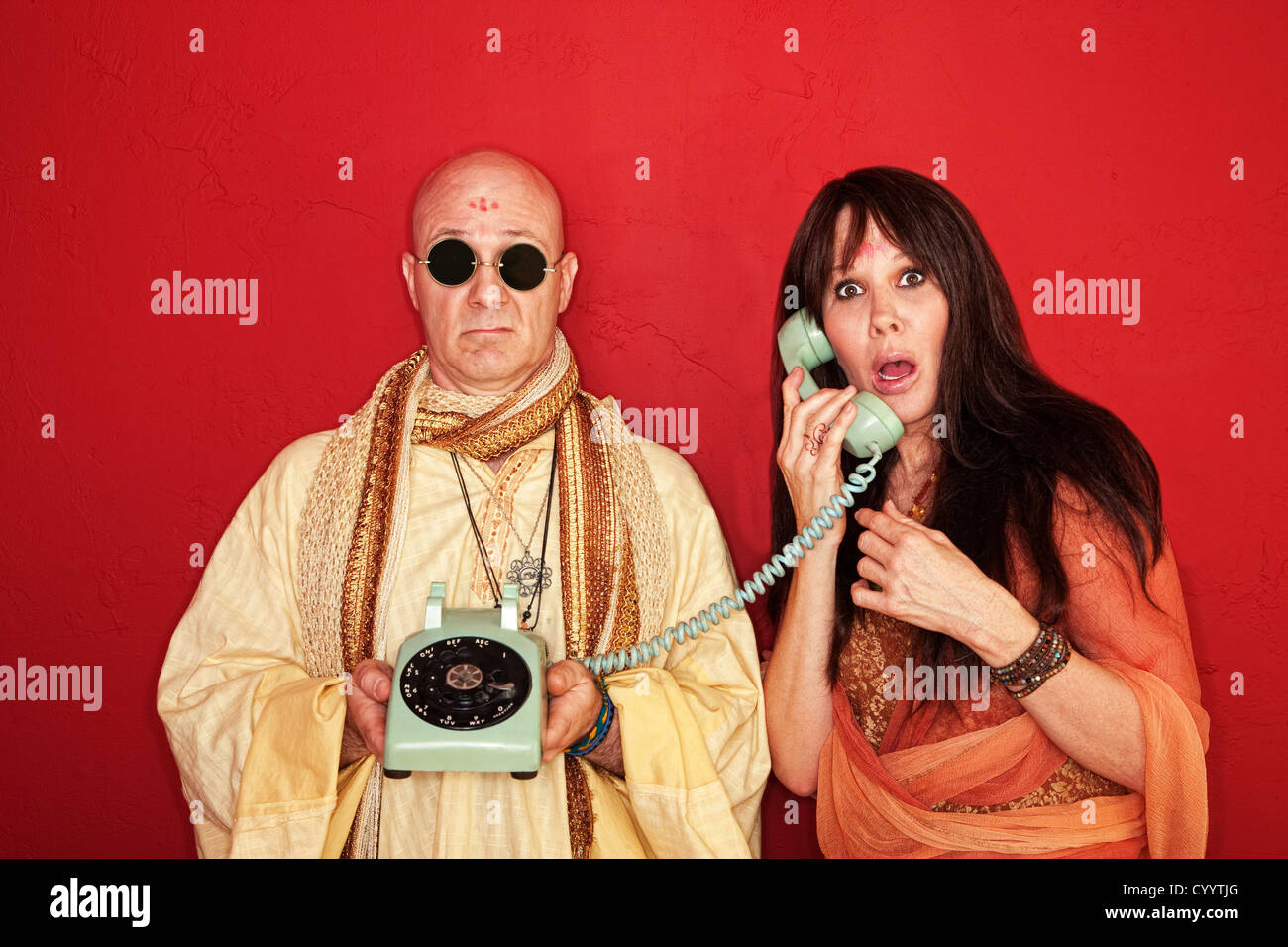 Shocked and disappointed hippies over maroon background Stock Photo - Alamy