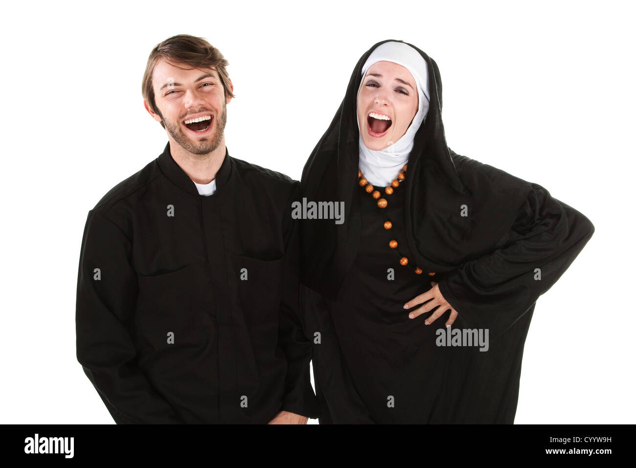 A young Catholic priest and nun bursting in laughter Stock Photo - Alamy