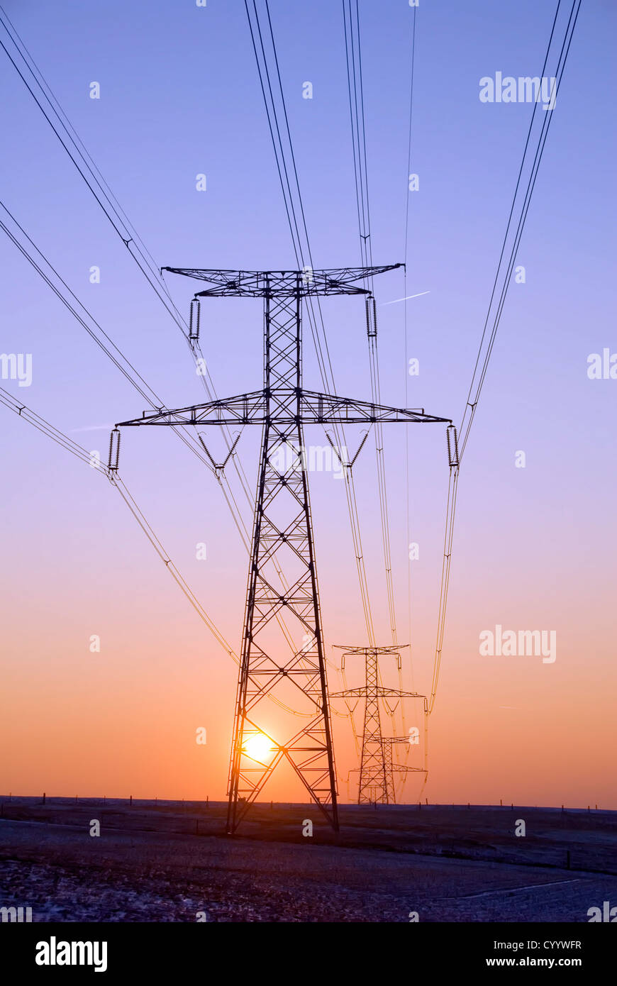 line of pylons on sunset background Stock Photo - Alamy