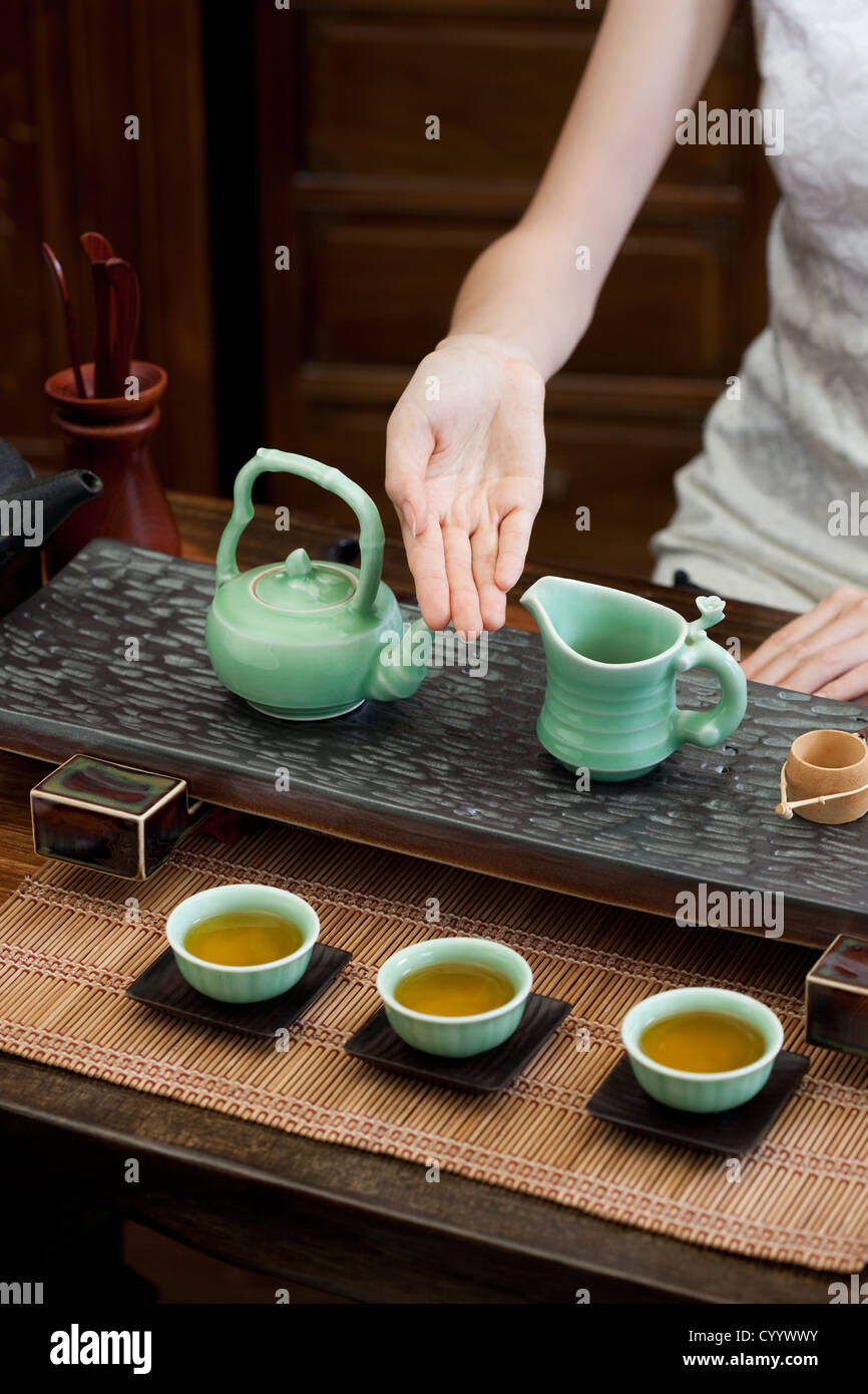 Young woman performing Chinese tea ceremony Stock Photo - Alamy