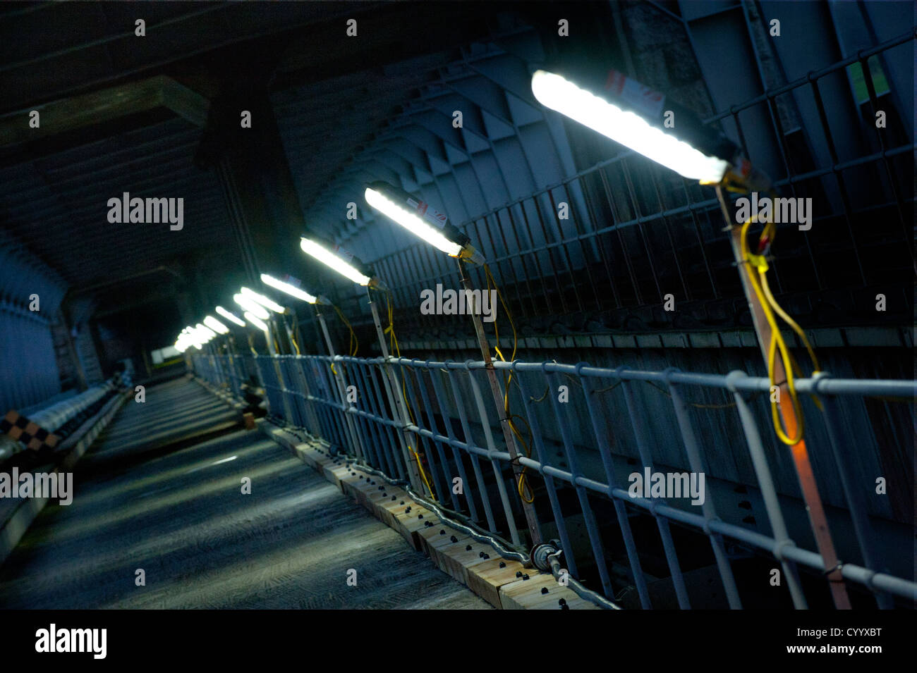 A service road illuminated by site lighting, trackside in the Britannia ...