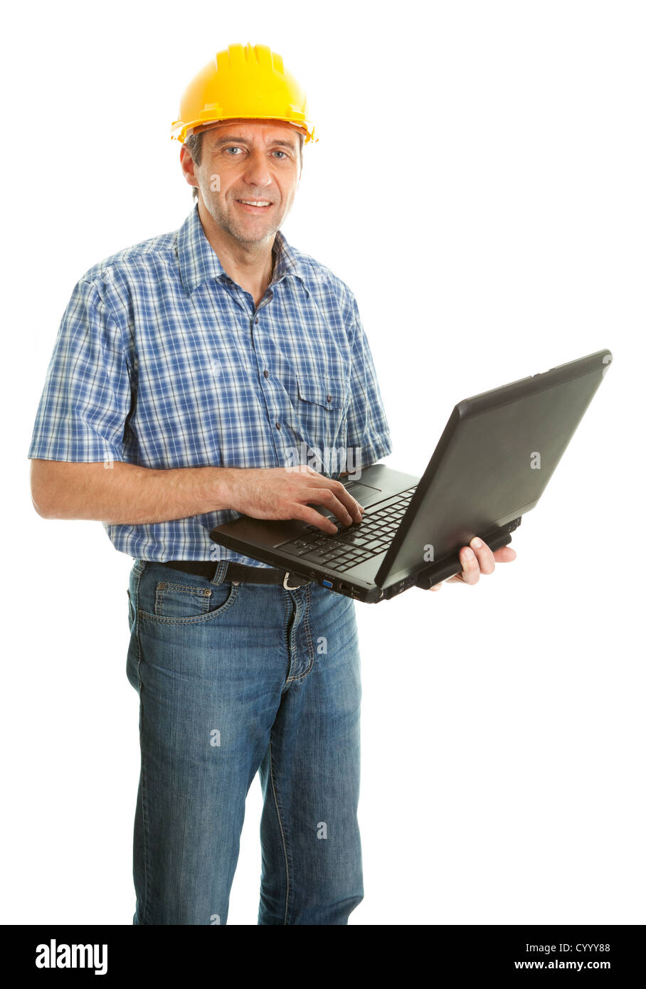 Confident worker wearing hard hat and using laptop. Isolated on white ...