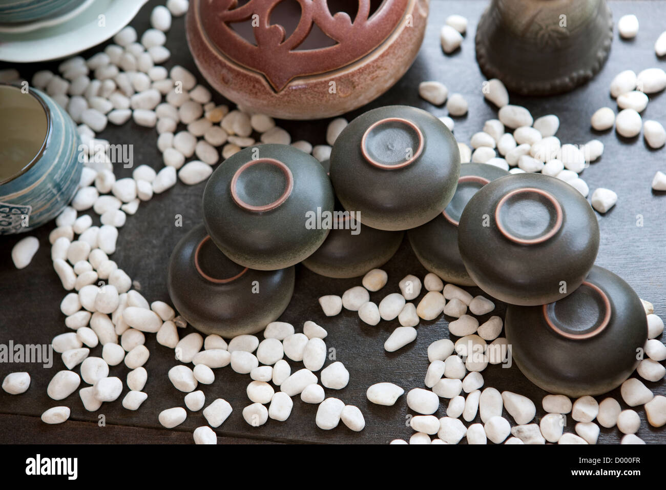Pebbles and Chinese tea cups Stock Photo - Alamy