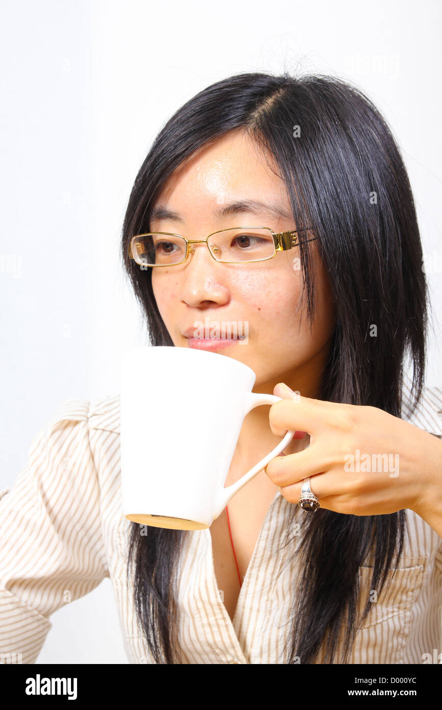 Chinese businesswoman drinking coffee Stock Photo - Alamy