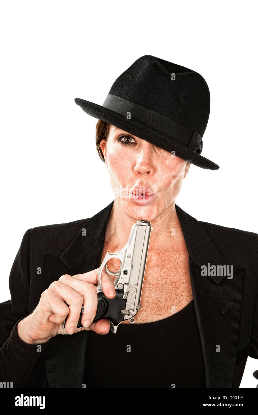 Woman blowing on the barrel end of a smoking gun Stock Photo - Alamy