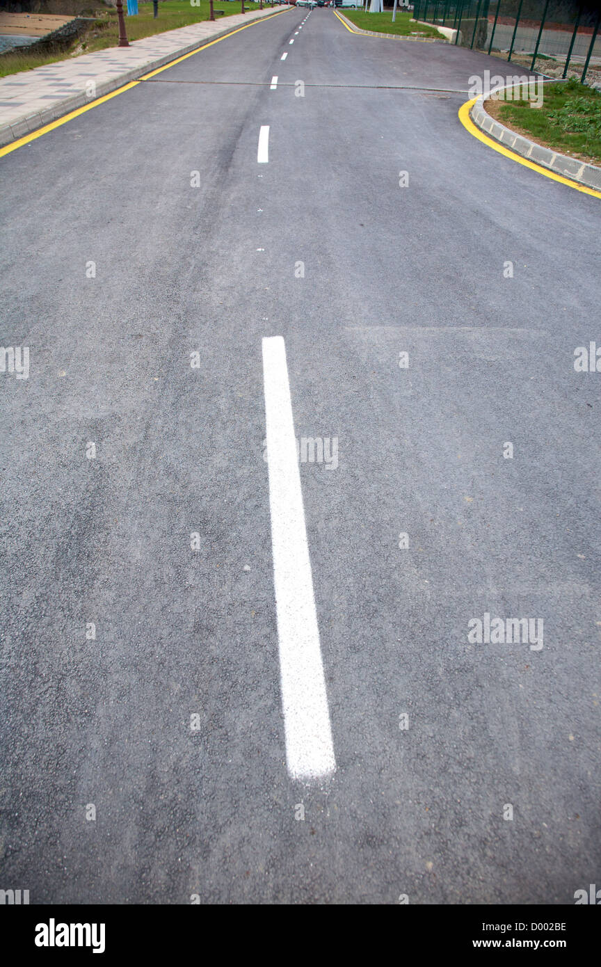 white lines painted on asphalt of road Stock Photo - Alamy