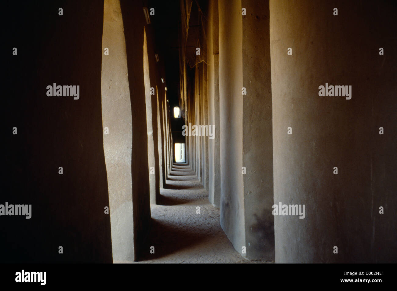 Djenne Mosque interior view along narrow colonnaded passageway Mali ...