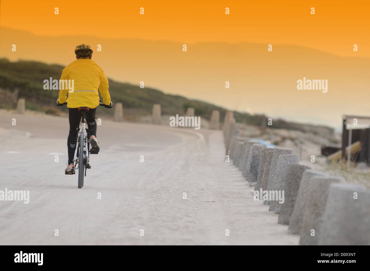 A person riding a bicycle Stock Photo - Alamy
