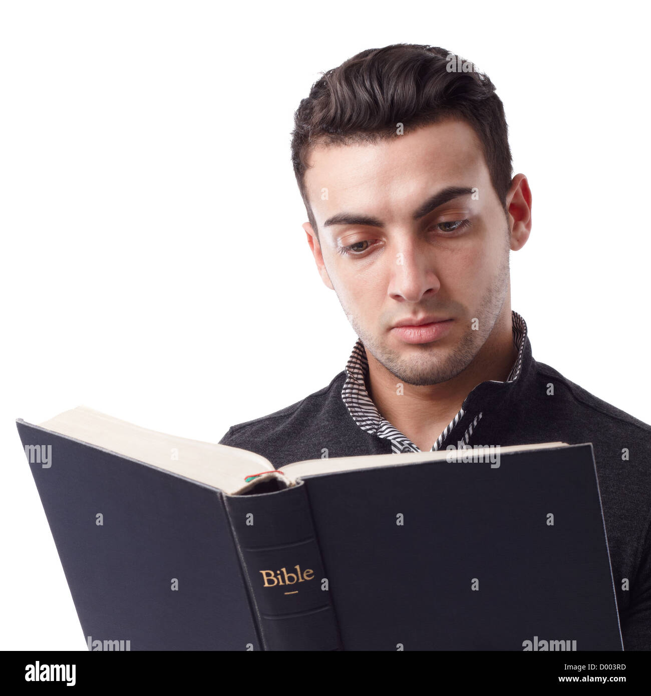 Portrait of a young man reading the Bible Stock Photo - Alamy