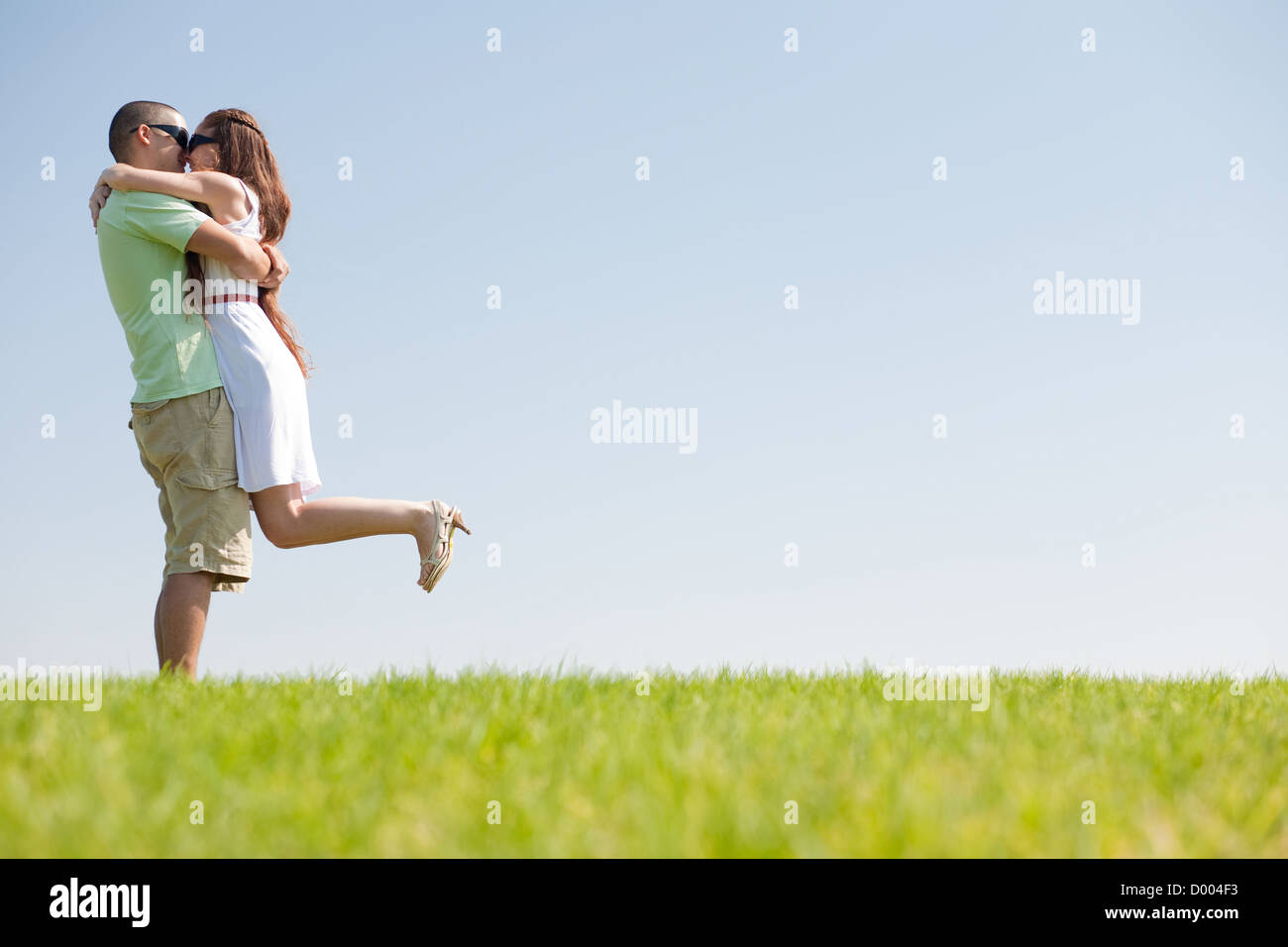 A Cheerful young Couple Fooling Around On The park Stock Photo - Alamy