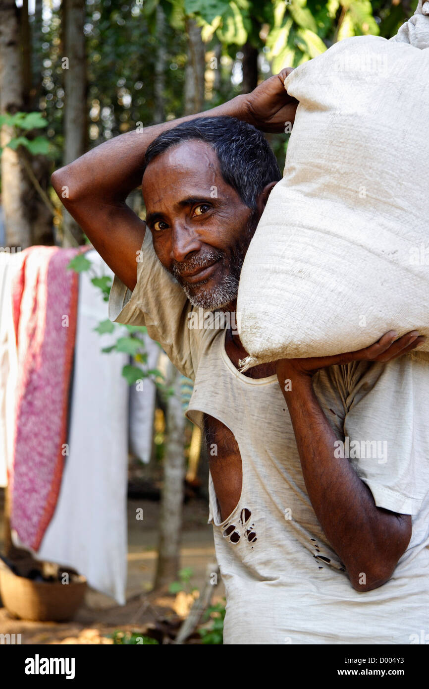Man carrying sack on shoulder hi-res stock photography and images - Alamy