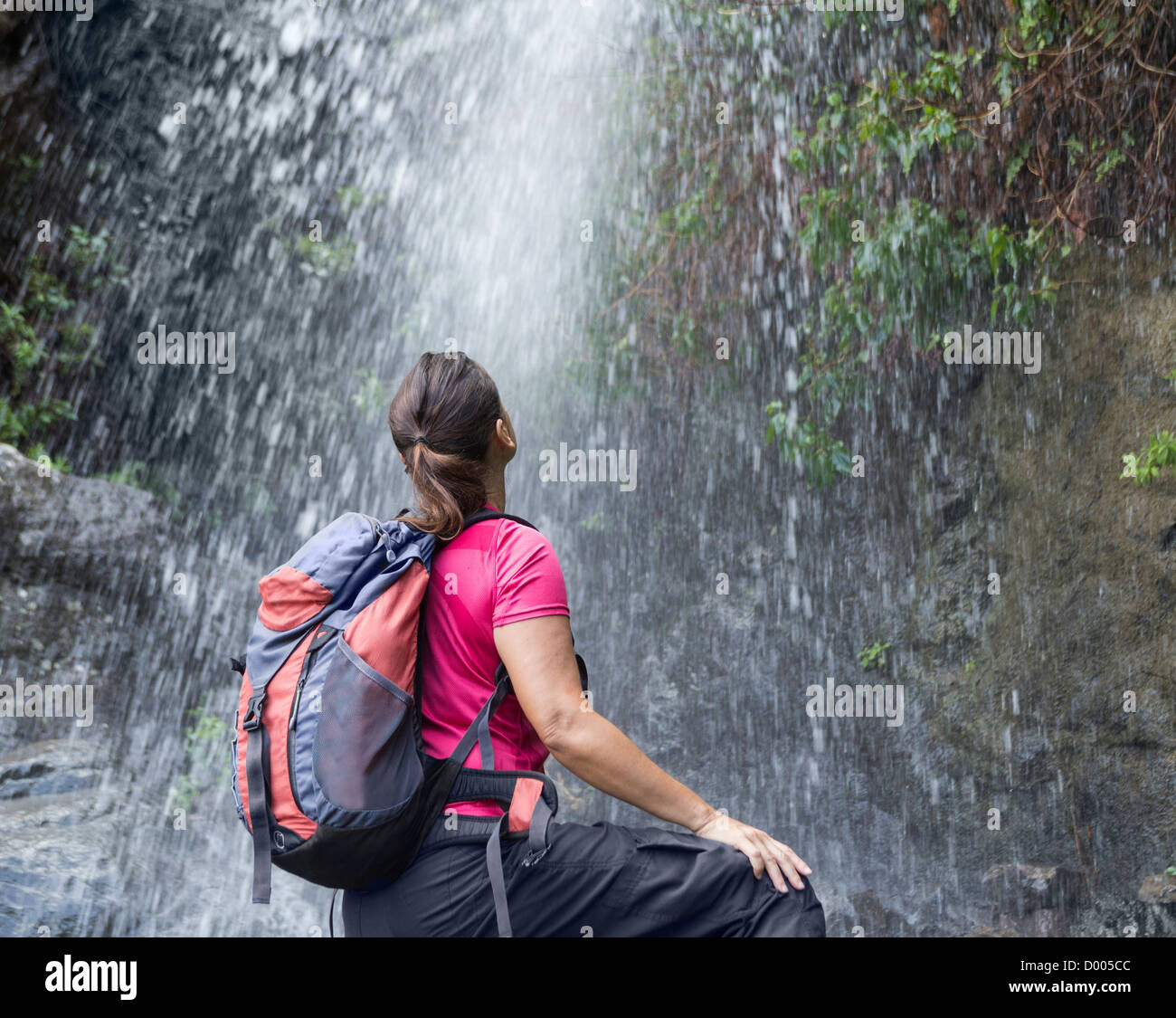 Female hiker near mountain waterfall on Gran Canaria, Canary Islands ...