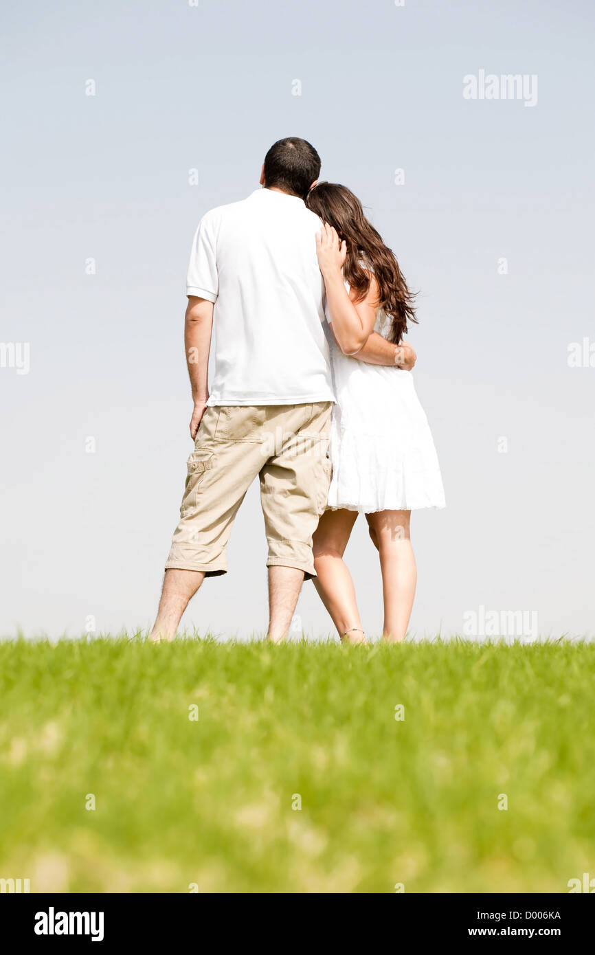 Rear view of romantic young couple standing on the park Stock Photo - Alamy