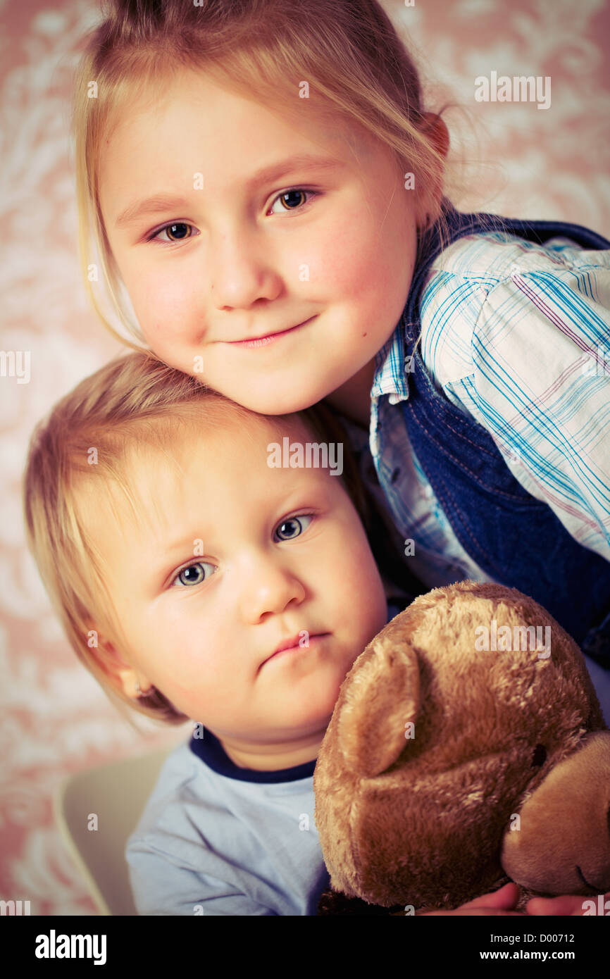 studio portrait of two sisters Stock Photo - Alamy