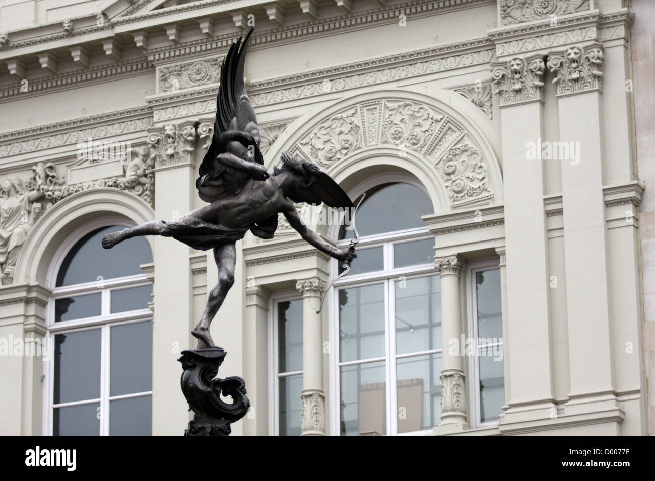 The statue of Eros, Piccadilly, in front of the Lillywhites building ...