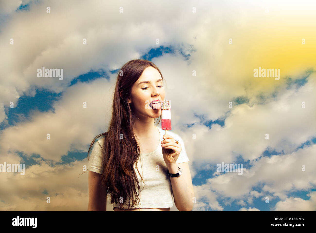 Young woman licking popsicle hi-res stock photography and images - Alamy