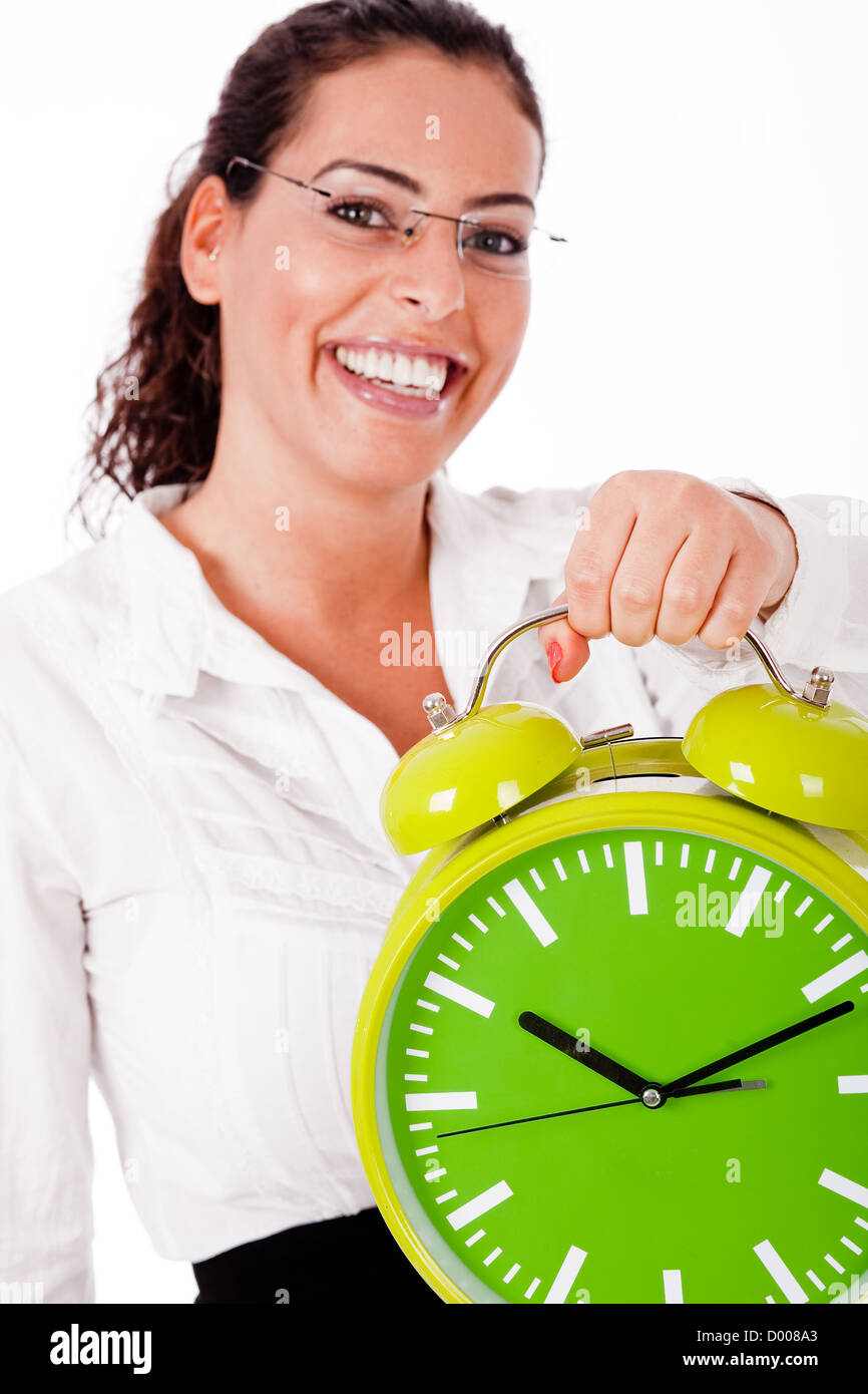 Young happy woman carrying a clock on a white isolated background Stock ...