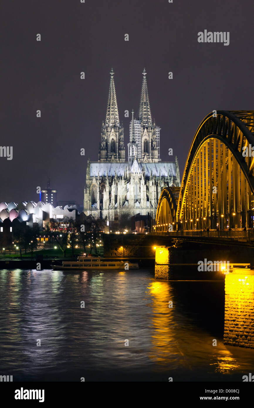 Riverside view of the Cologne Cathedral and railway bridge over the ...